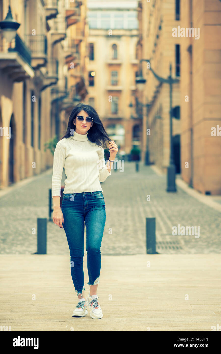 Beautiful woman walking on the street Stock Photo - Alamy
