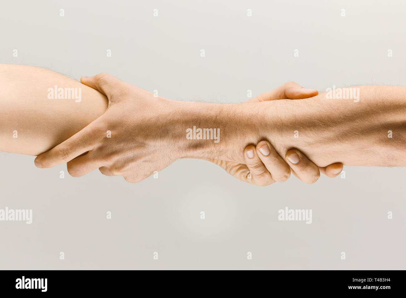 Stronger together. Male hands demonstrating a gesture of holding and ...
