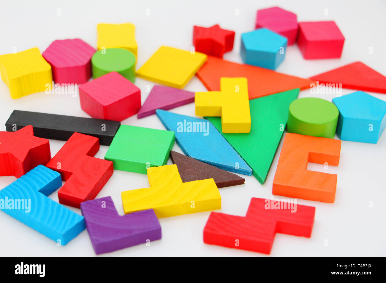 Multi-colored cubes and figures with numbers laid out randomly on a ...