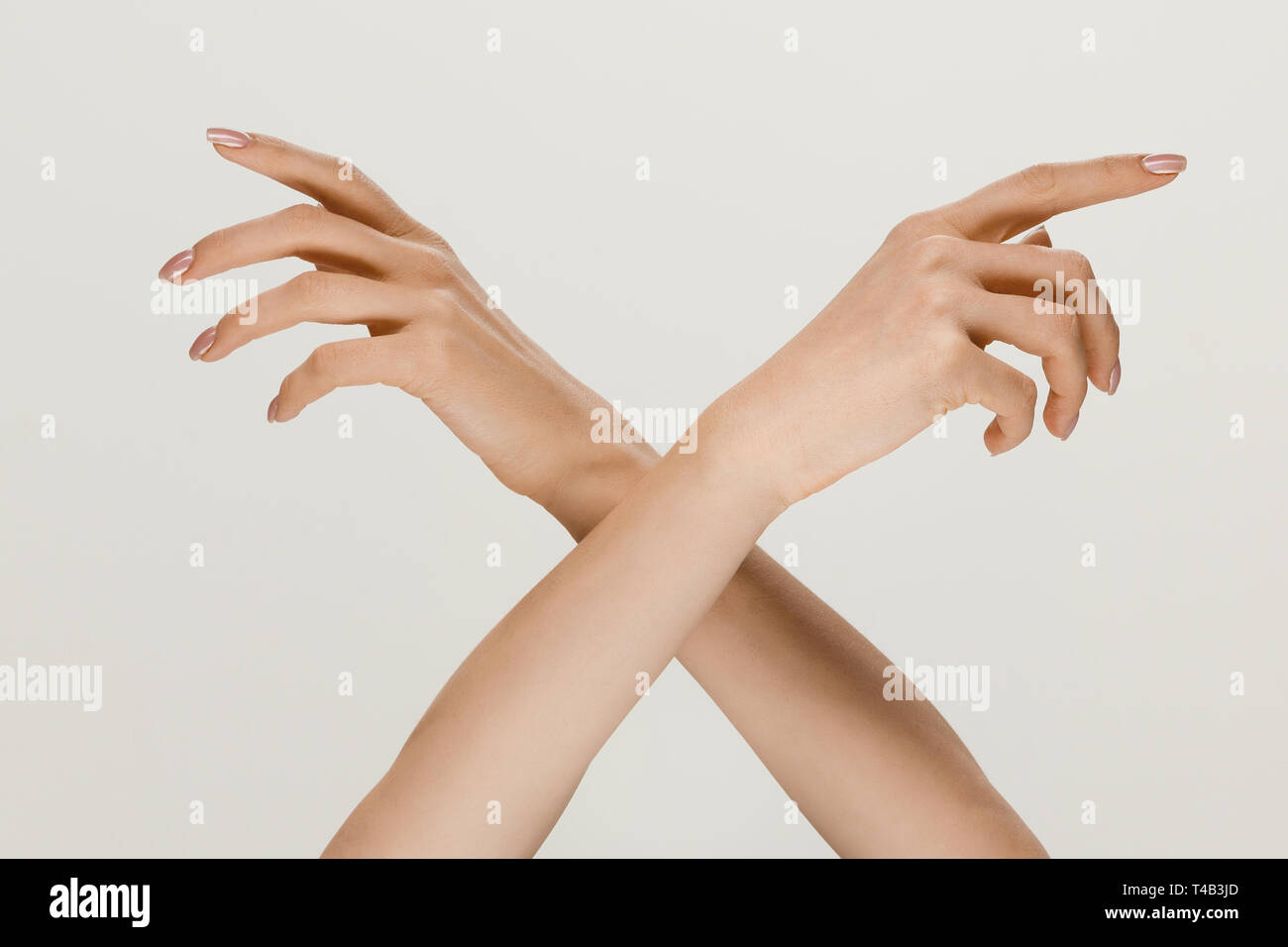 Choosing a right way. Male and female hands demonstrating a gesture of ...