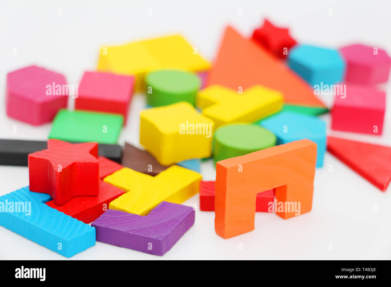 Multi-colored cubes and figures with numbers laid out randomly on a ...