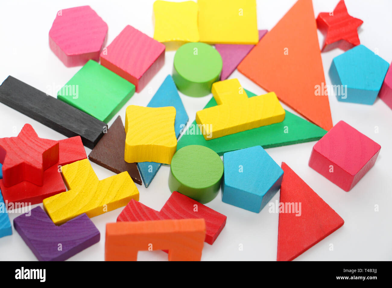 Multi-colored cubes and figures with numbers laid out randomly on a ...