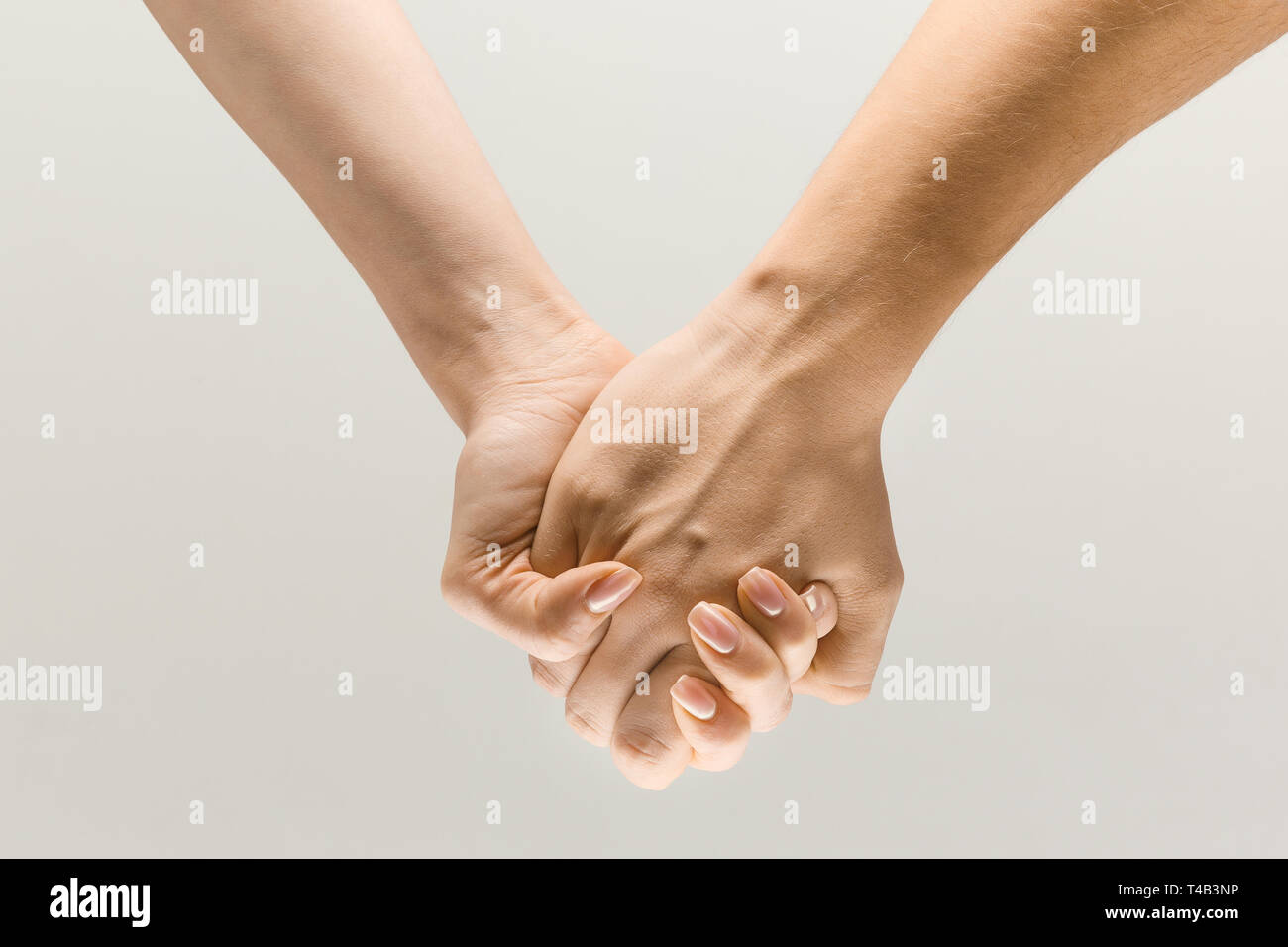 Leading you on. loseup shot of male and female holding hands isolated ...