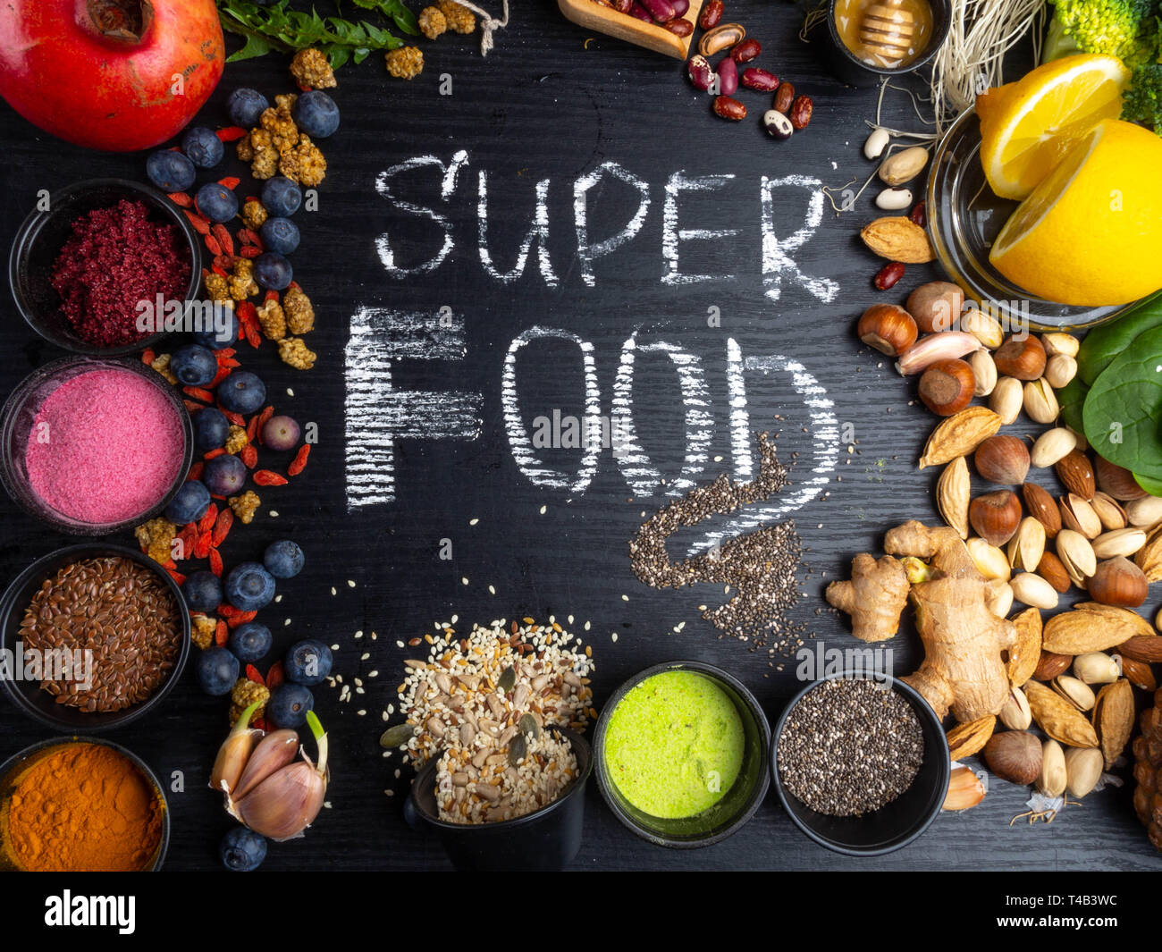Super food selection. Various super foods and healthy foods in wooden ...