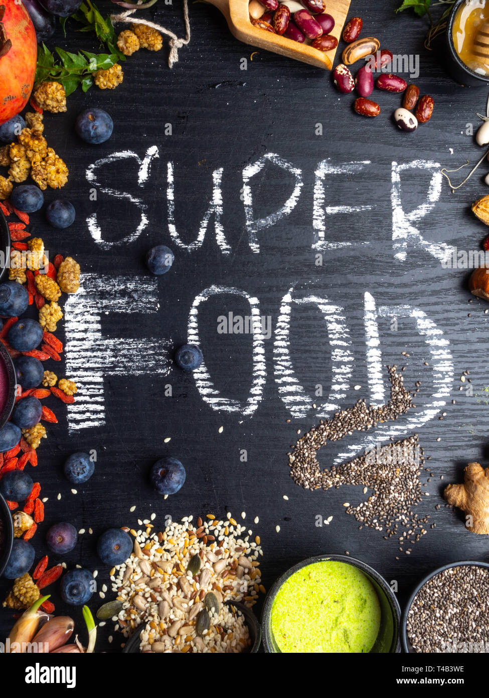 Super food selection. Various super foods and healthy foods in wooden ...