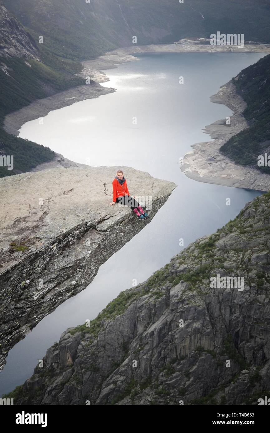 TROLLTUNGA, NORWAY - JULY 16, 2015: Tourist visits Troll's Tongue ...