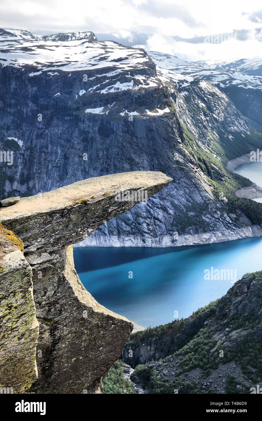 Troll's Tongue in Norway. Tourist attraction known as Trolltunga. Rock ...