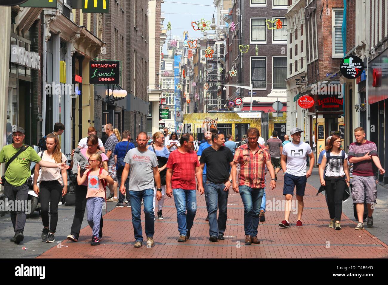 AMSTERDAM, NETHERLANDS - JULY 7, 2017: People visit Nieuwendijk ...