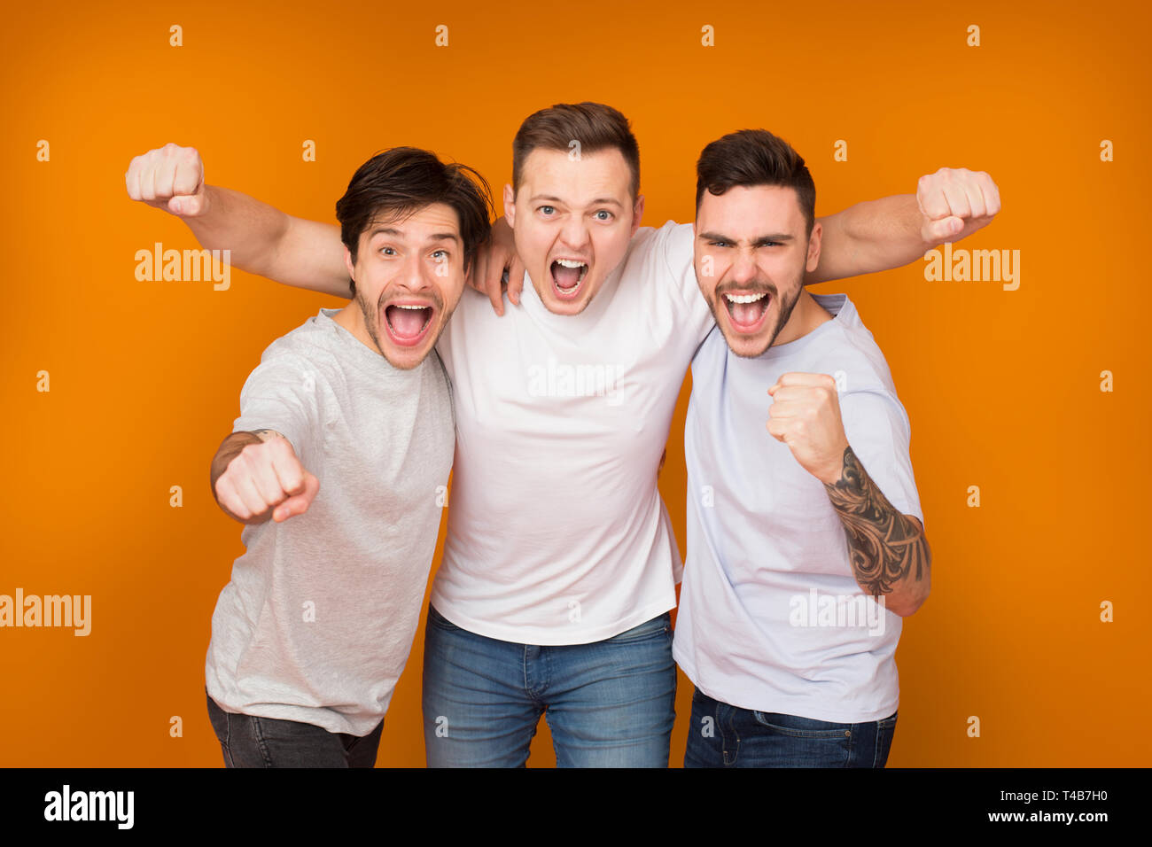 Yes. Cheerful men shouting and celebrating victory Stock Photo - Alamy