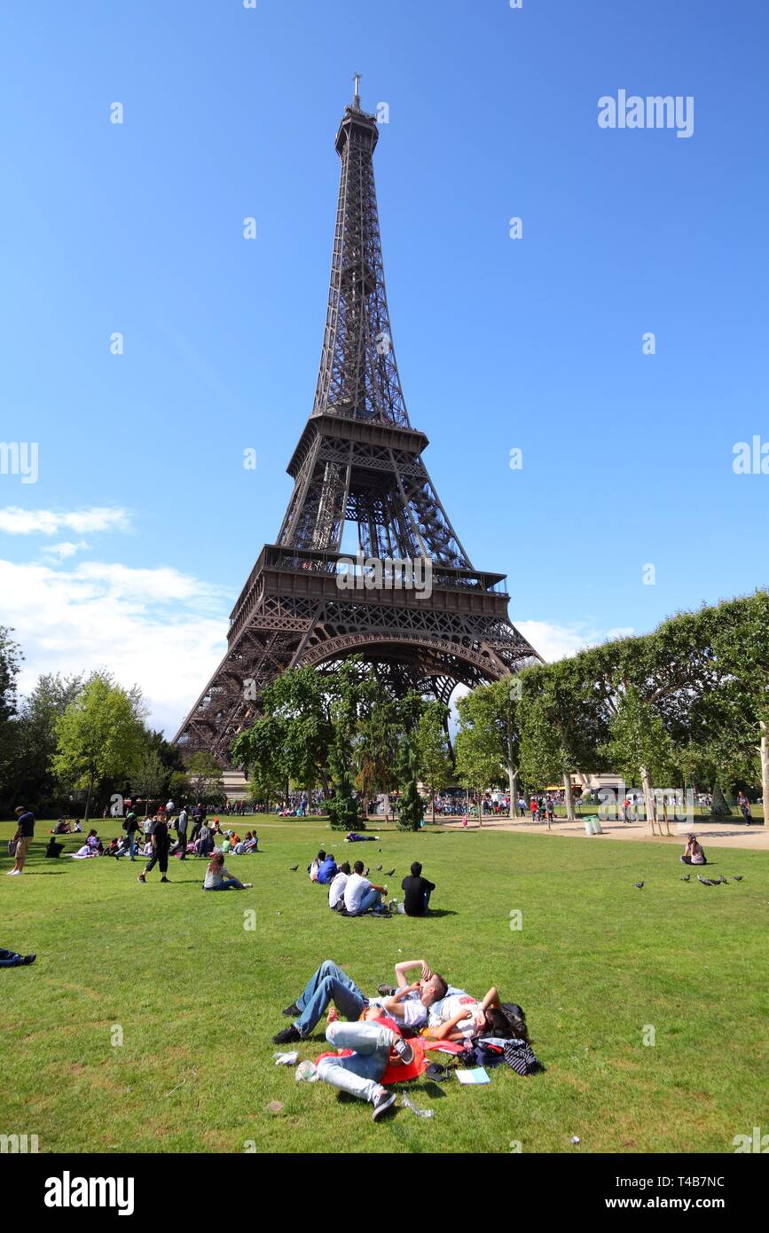PARIS - JULY 21: People rest in front of Eiffel Tower on July 21, 2011 ...