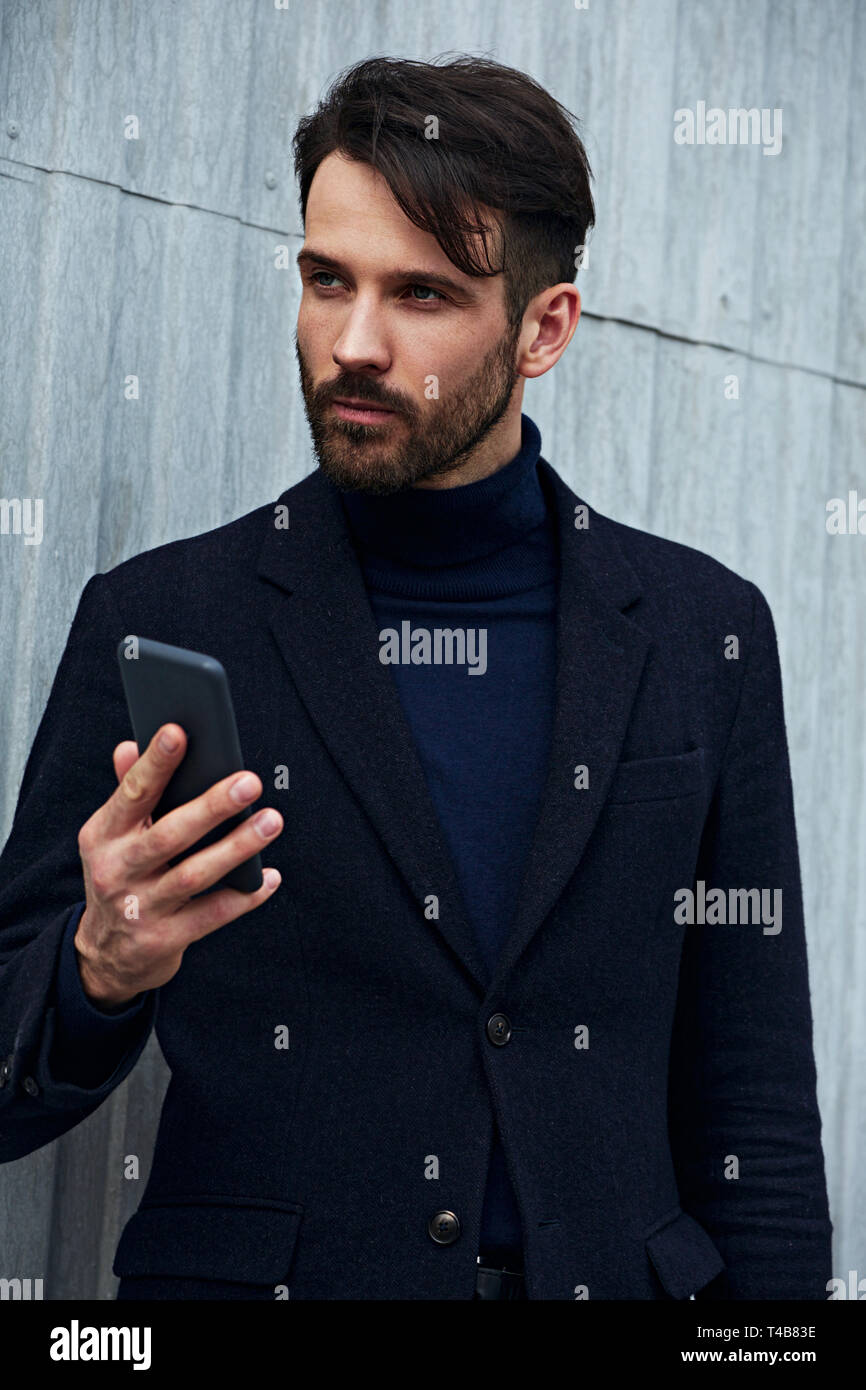 Fashion beard style business handsome male model working and holding ...
