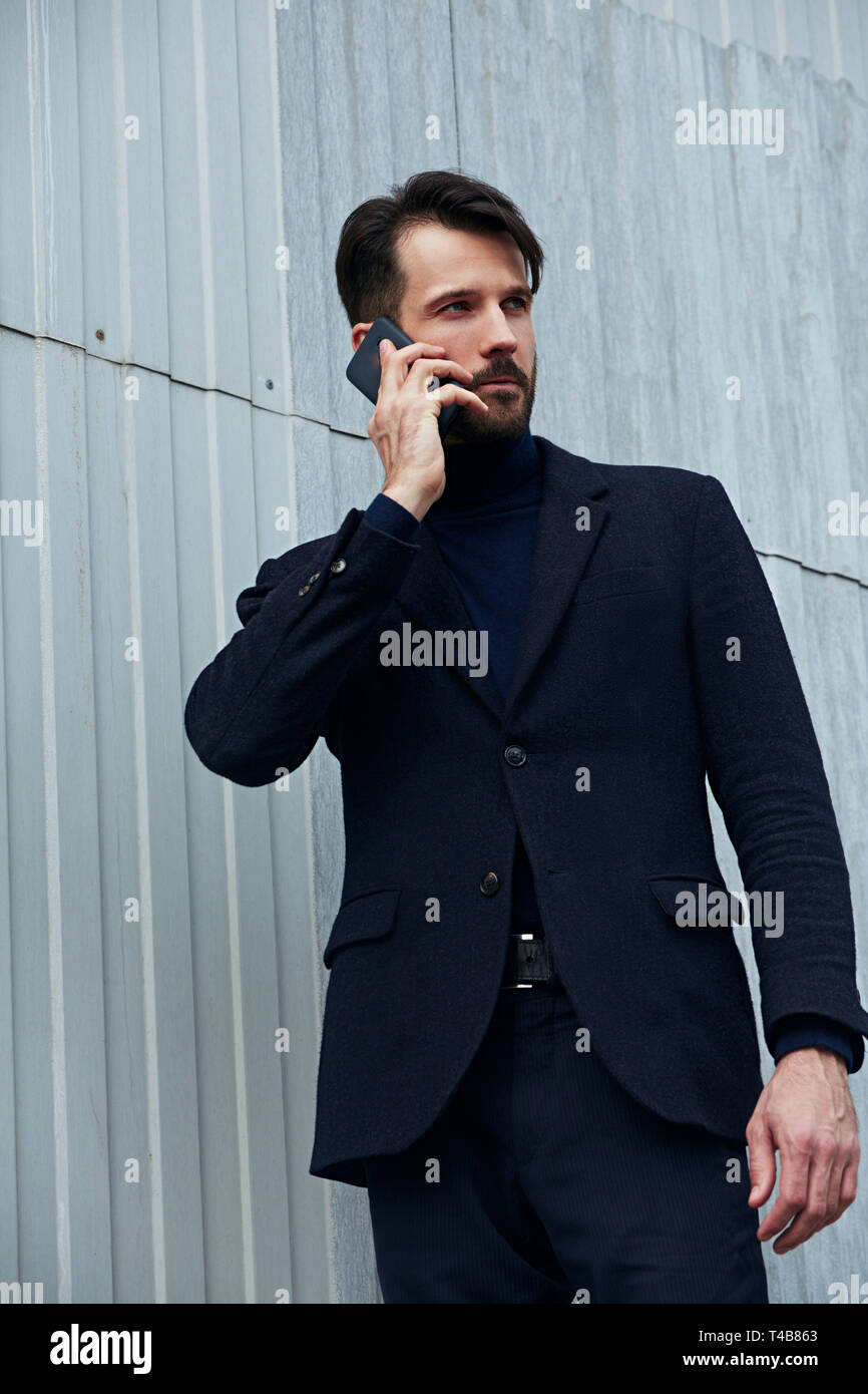 Fashion beard style business handsome male model working and calling on ...