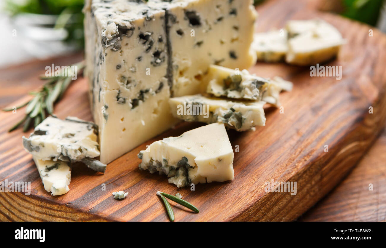 Chopped blue cheese on board Stock Photo - Alamy