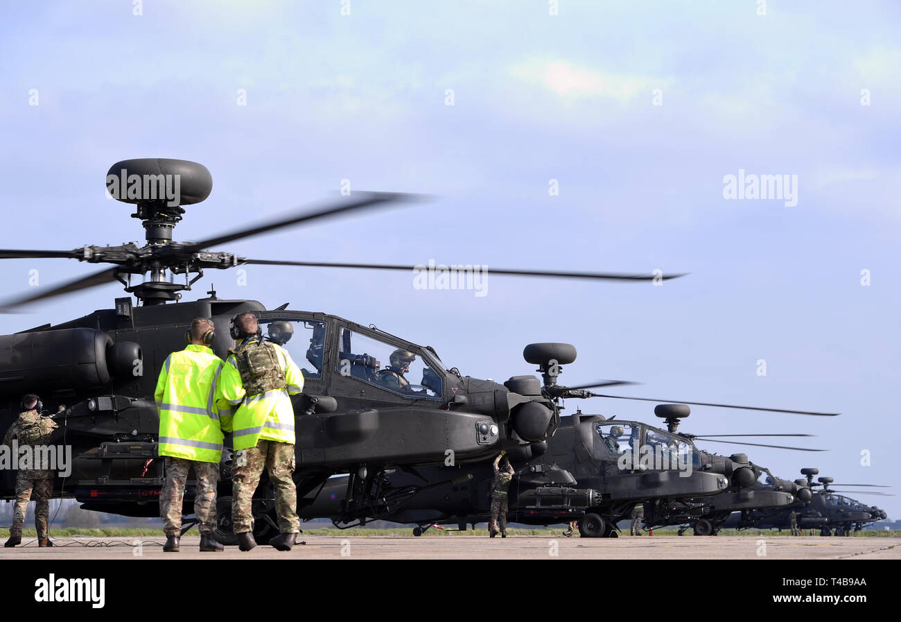 Final Checks Are Carried Out On Five Apache Helicopters On The Flight Line At Wattisham Airfield