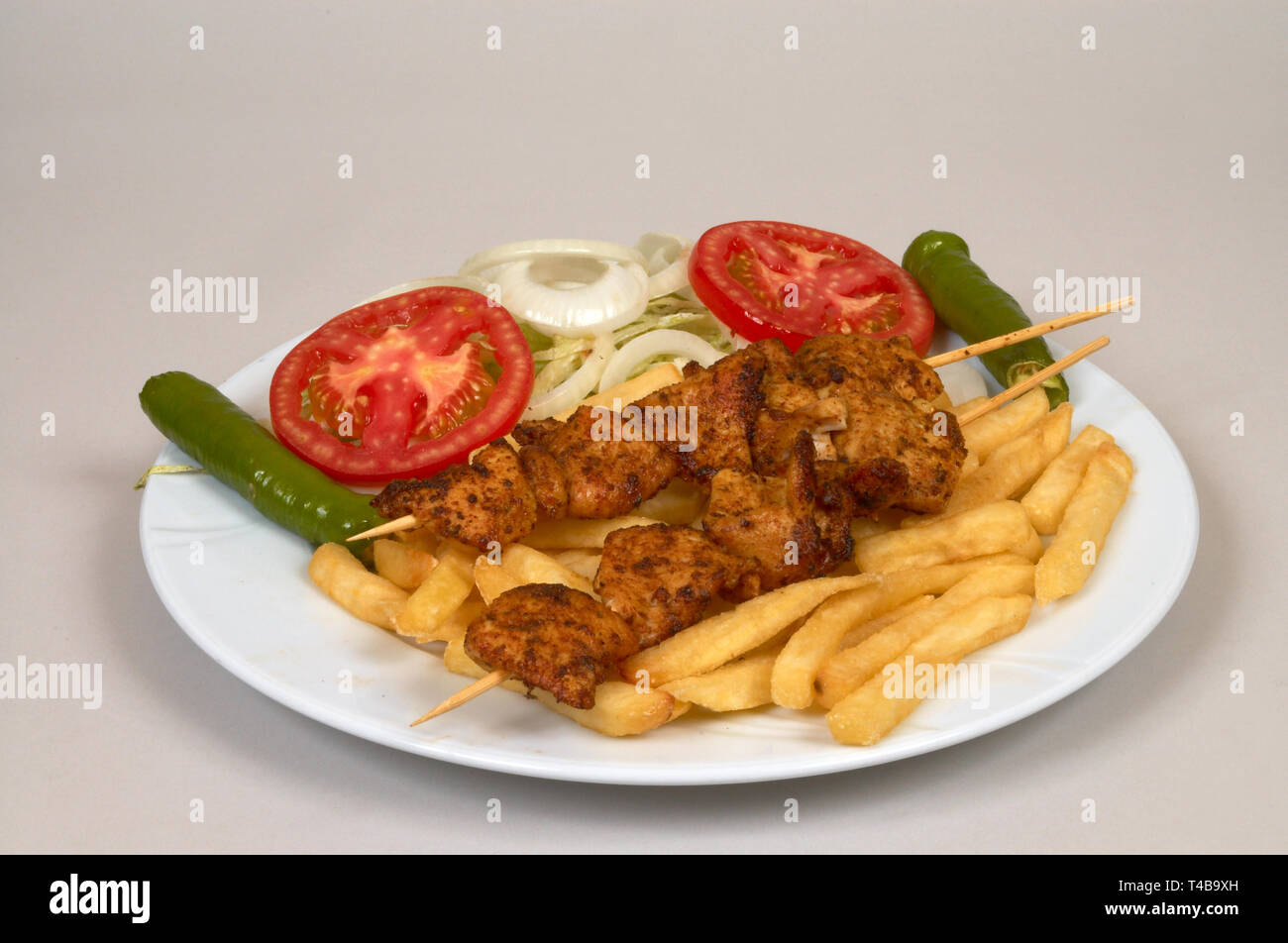 Chicken fillet ready to serve with french fries and salads Stock Photo ...