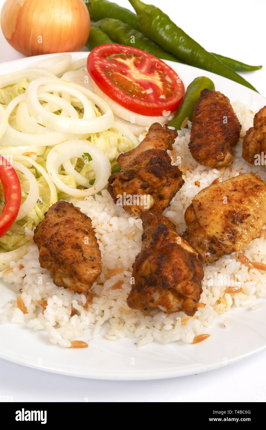 Chicken wings with rice and salads Stock Photo - Alamy