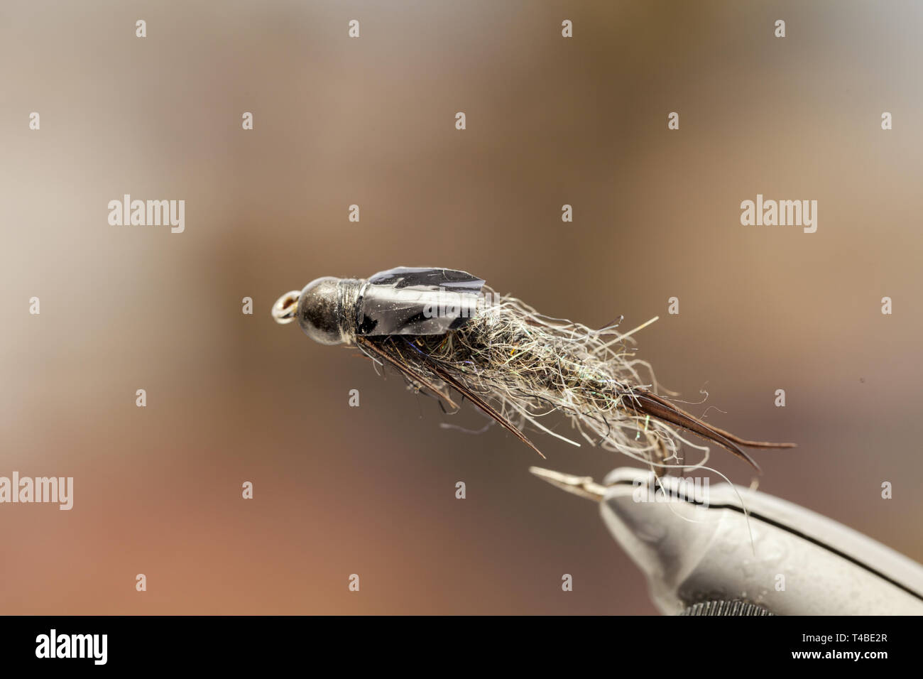 fly fishinig, fly tying hooks close up Stock Photo - Alamy