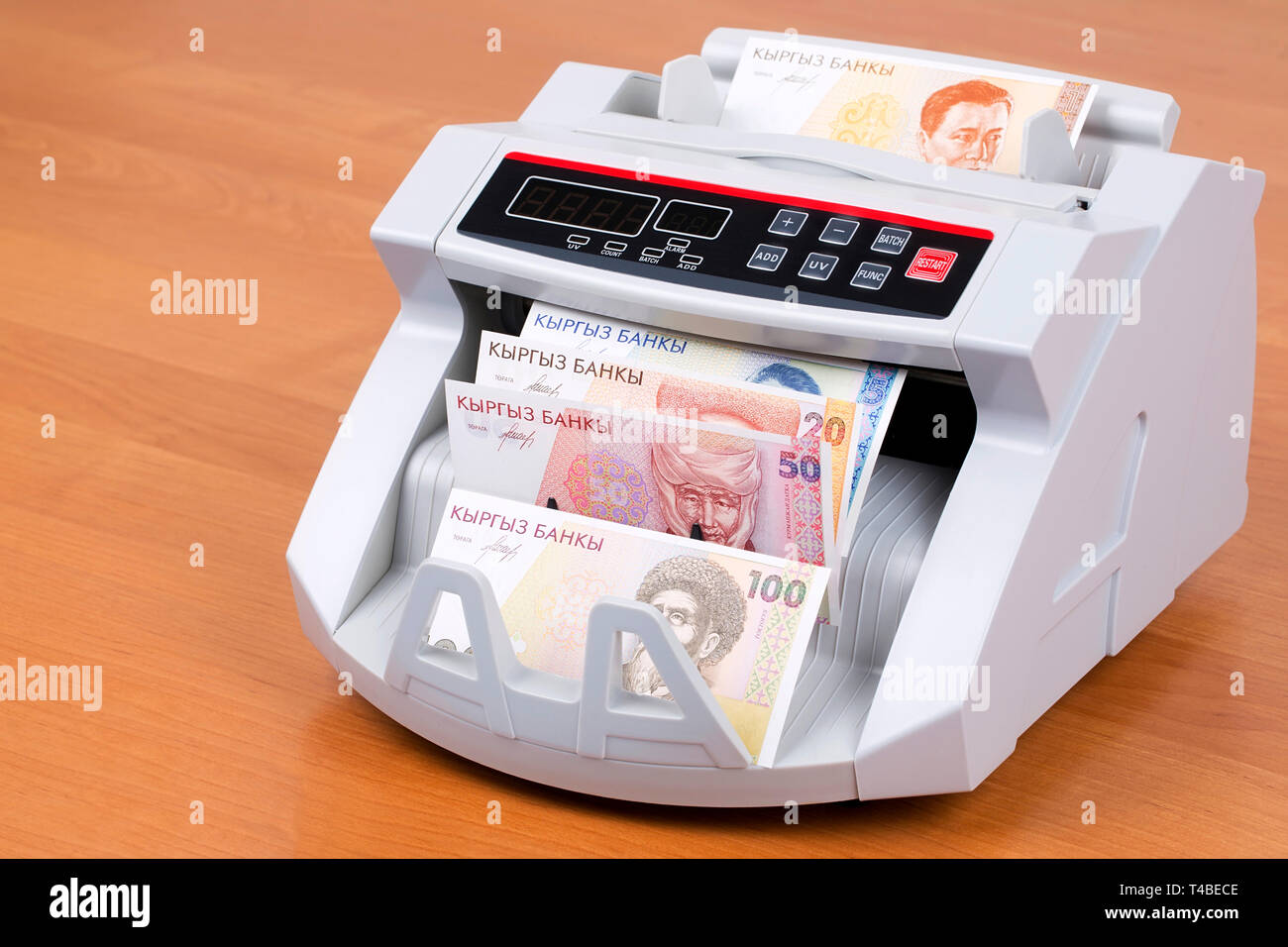 Old money from Kyrgyzstan in a counting machine Stock Photo - Alamy