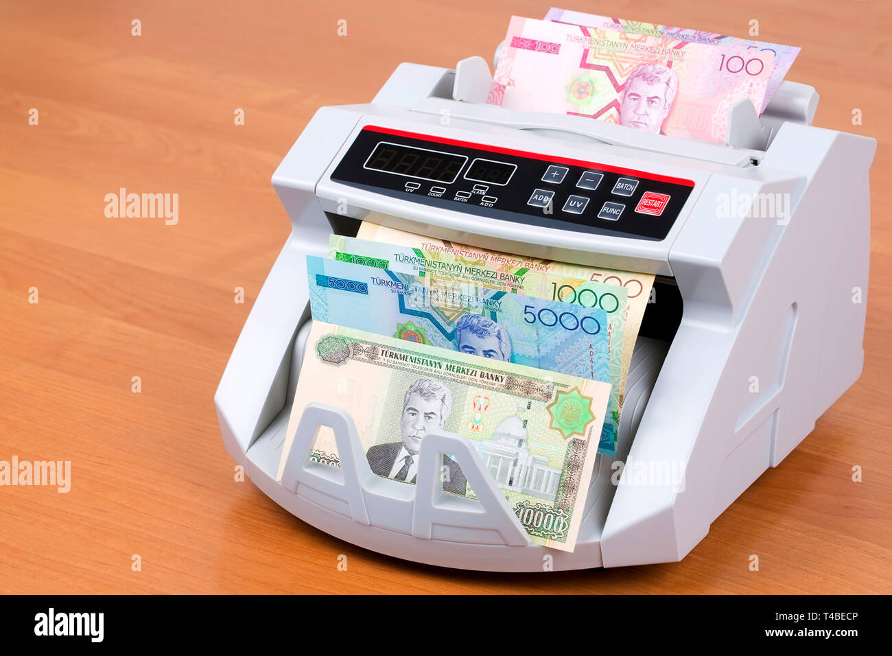 Old money from Turkmenistan in a counting machine Stock Photo - Alamy
