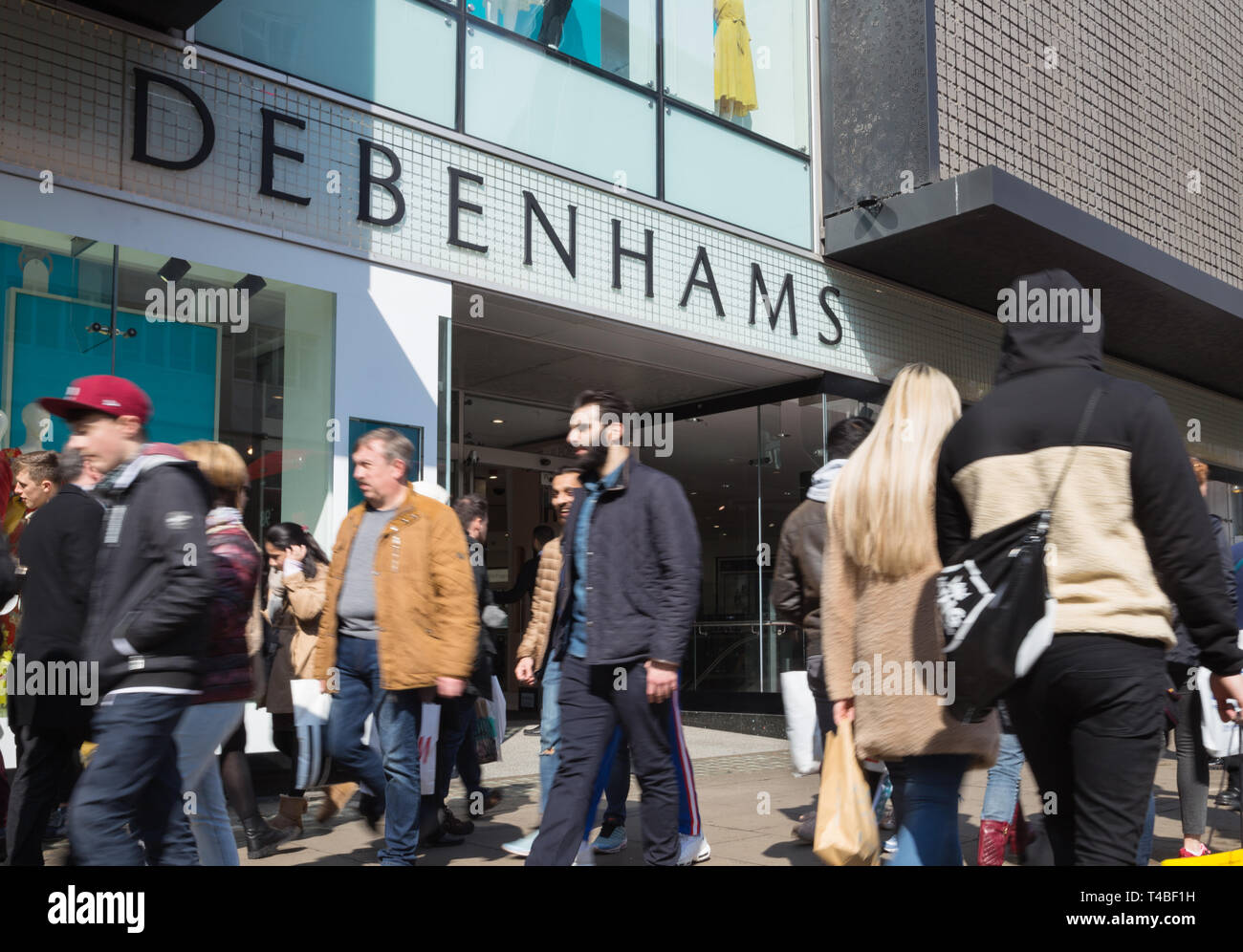 Shoppers walk past the Debenhams flagship store in Oxford Street ...