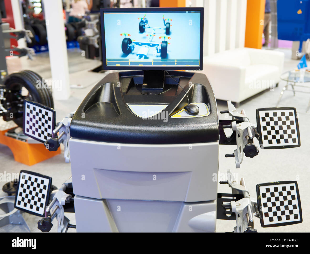 Wheel alignment stand with infrared communication Stock Photo - Alamy