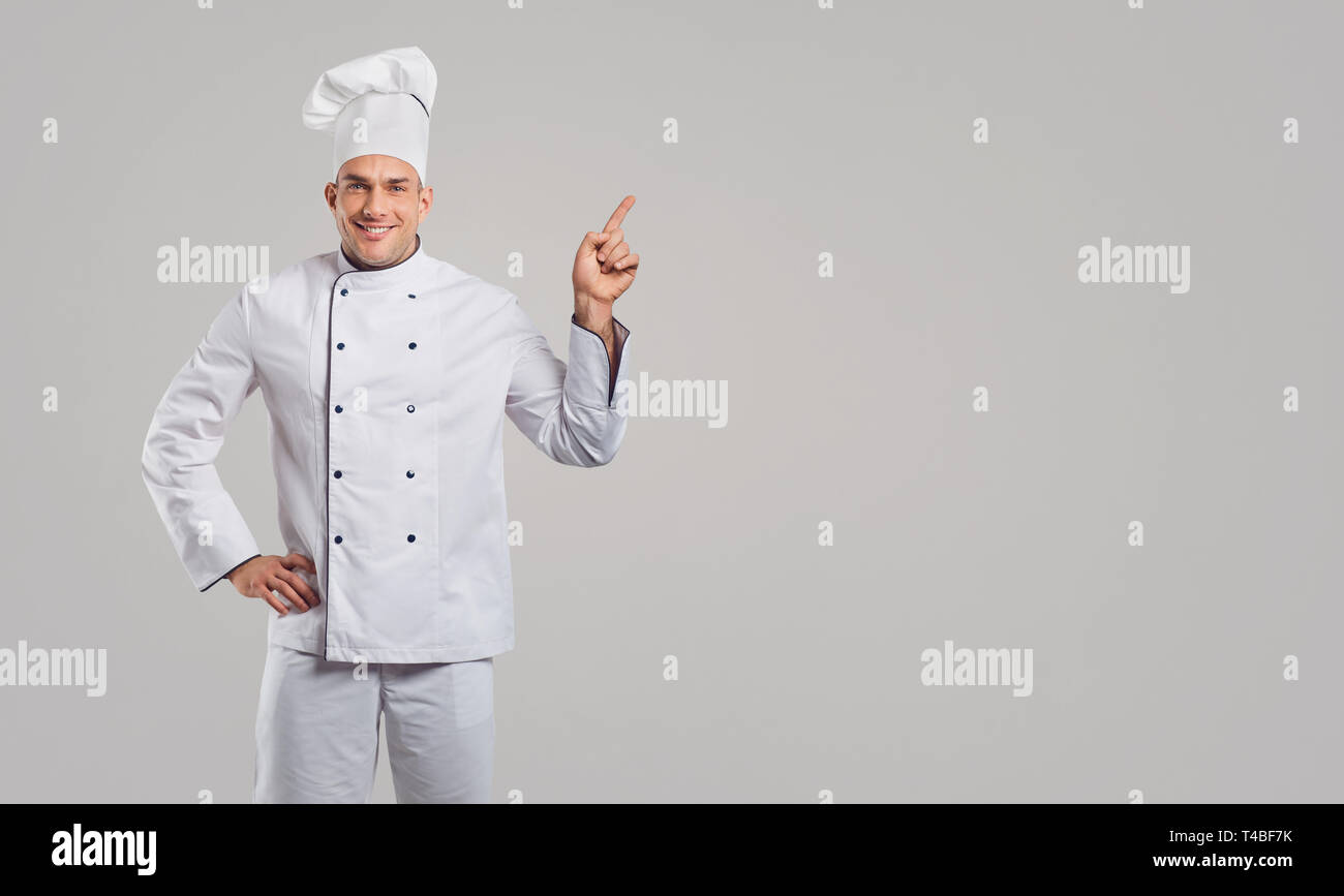 The guy the cook in white clothes smiles Stock Photo - Alamy