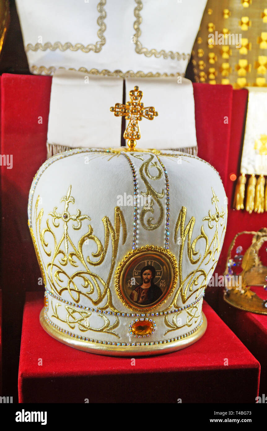 The headdress of the priest decorated with icons and a cross inlaid ...
