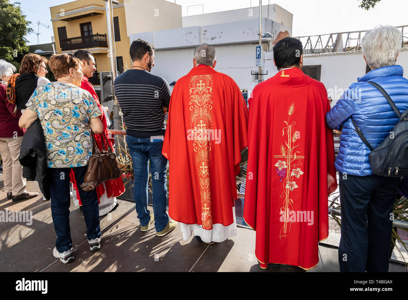 Priests in red robes watching the Pasión de Los Niños, Passion of the ...