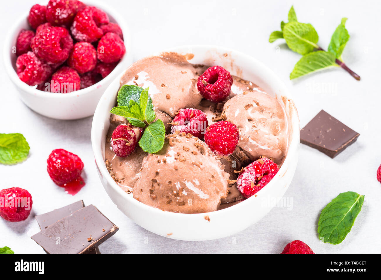 Chocolate ice cream with raspberries Stock Photo - Alamy
