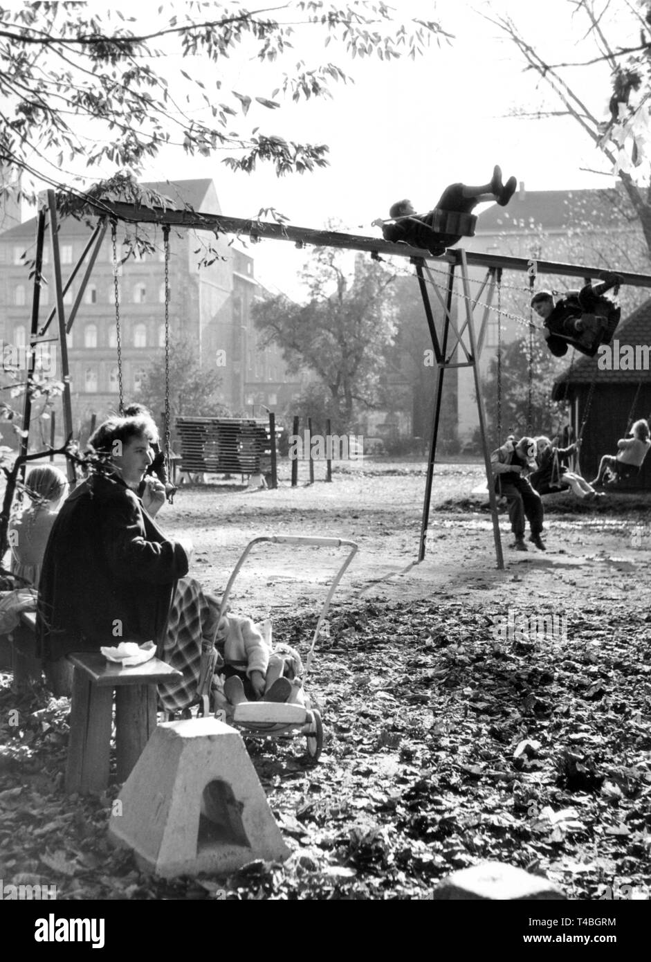 At a playground in Munich in 1954, mothers and children enjoyed the ...