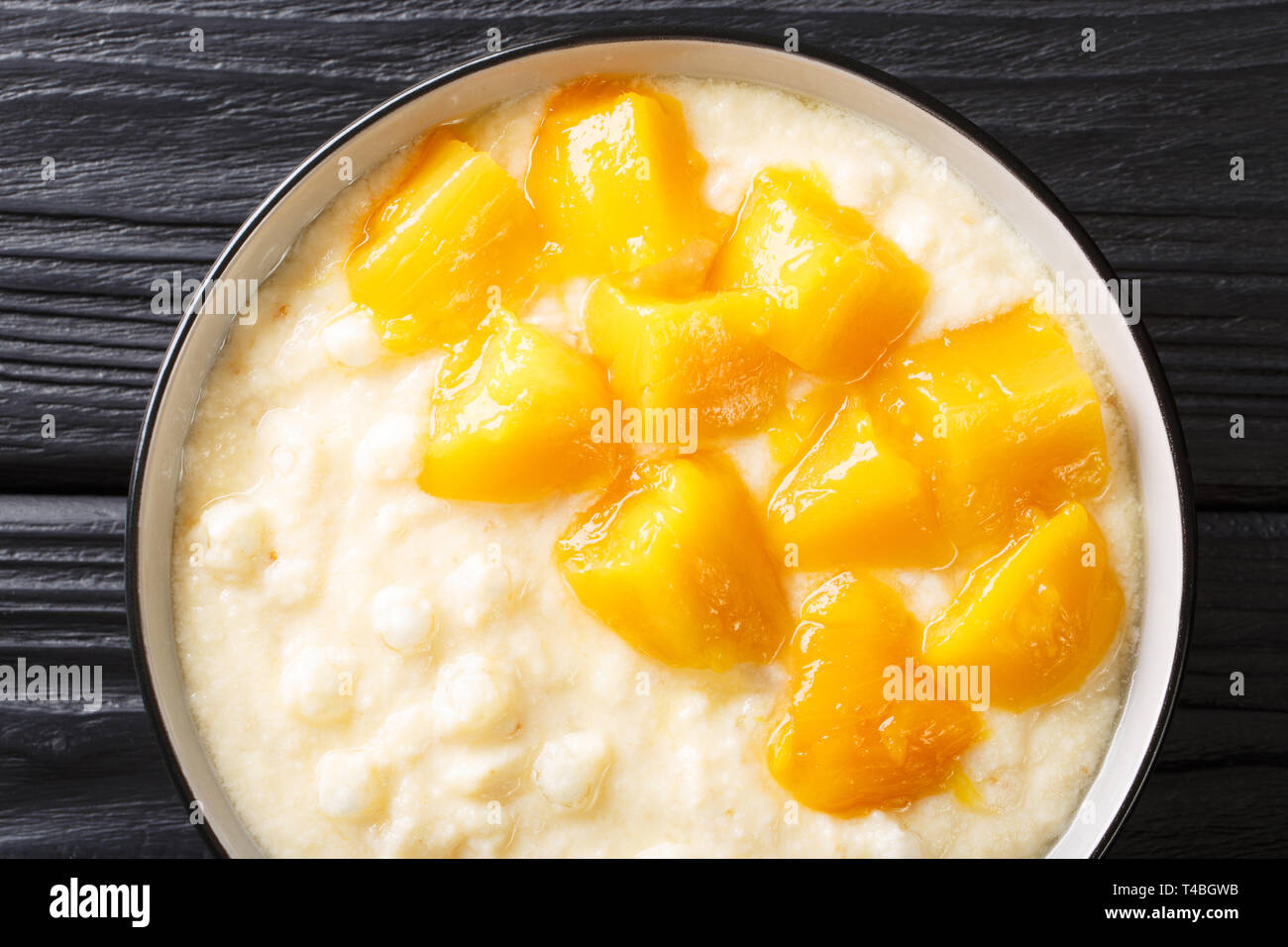 Traditional asian tapioca pudding with coconut milk and fresh mango ...