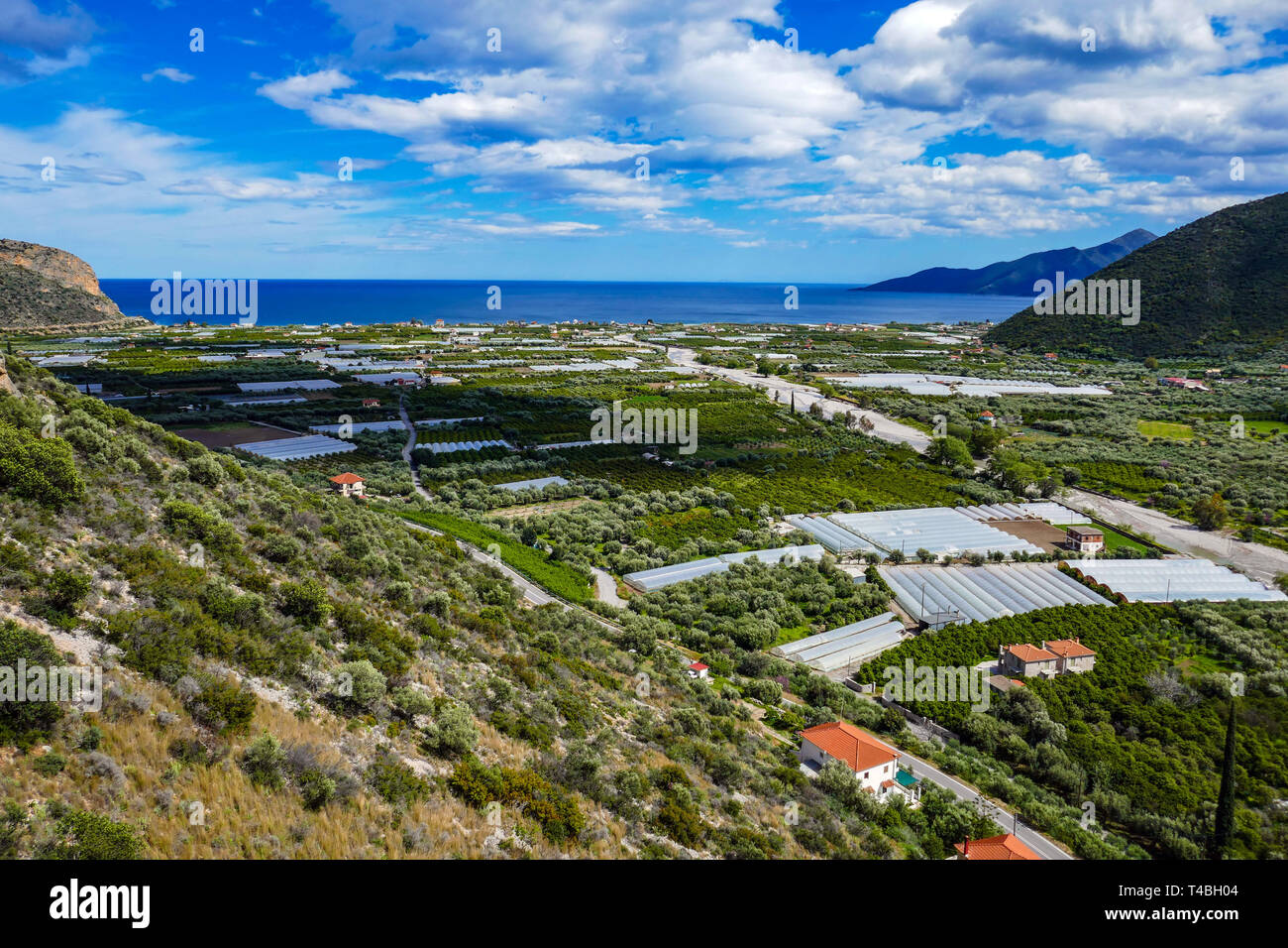 Fields, poly-tunnels and the sea, near the small agricultural town of ...
