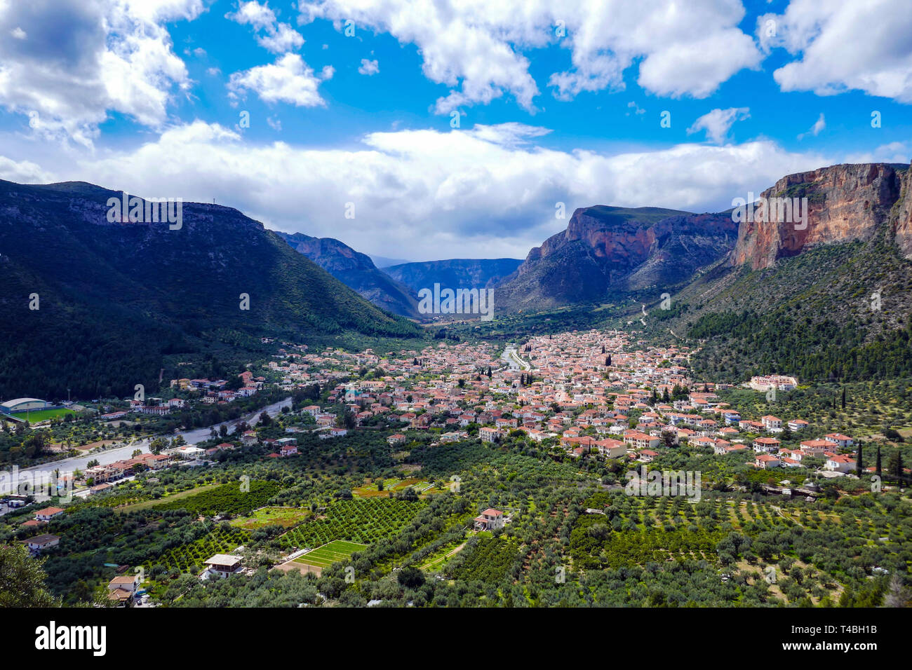 The small agricultural town of Leonidio surrounded by stark cliffs, the ...