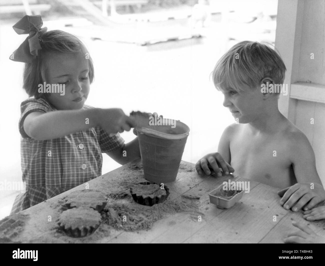 Children bake Madeira cake on a playground in Stuttgart (July 1958 ...