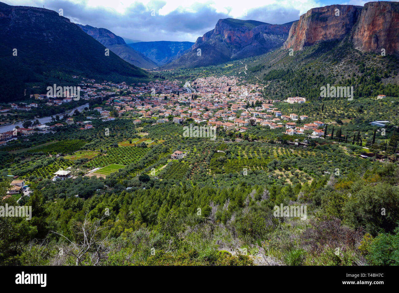 The small agricultural town of Leonidio surrounded by stark cliffs, the ...