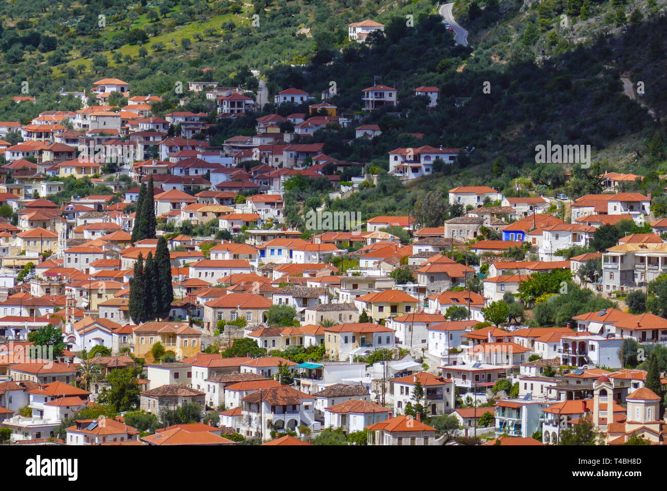 The small agricultural town of Leonidio surrounded by stark cliffs, the ...