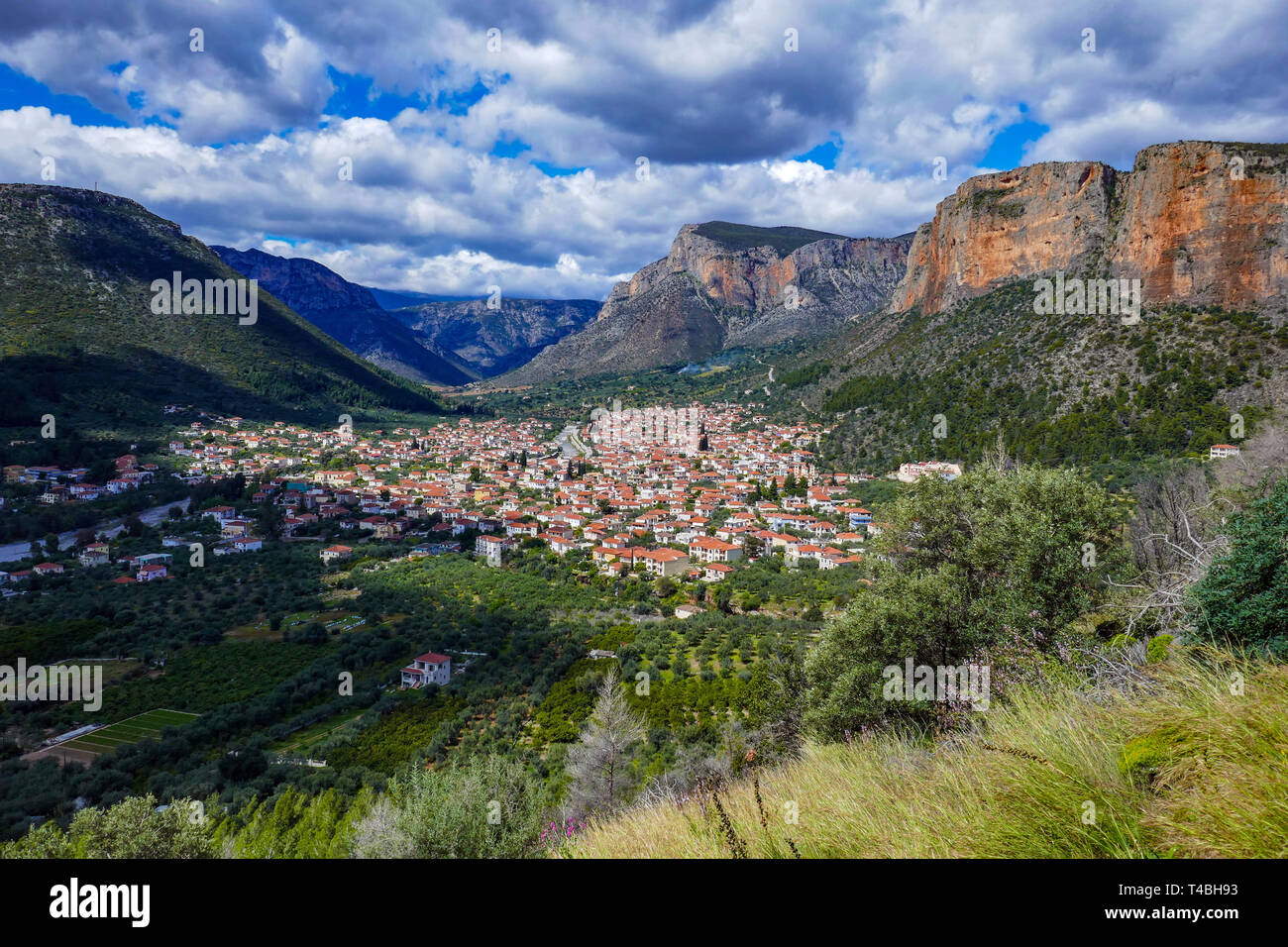 The small agricultural town of Leonidio surrounded by stark cliffs, the ...