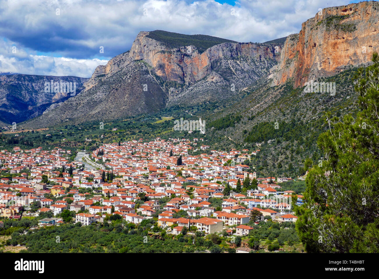The small agricultural town of Leonidio surrounded by stark cliffs, the ...