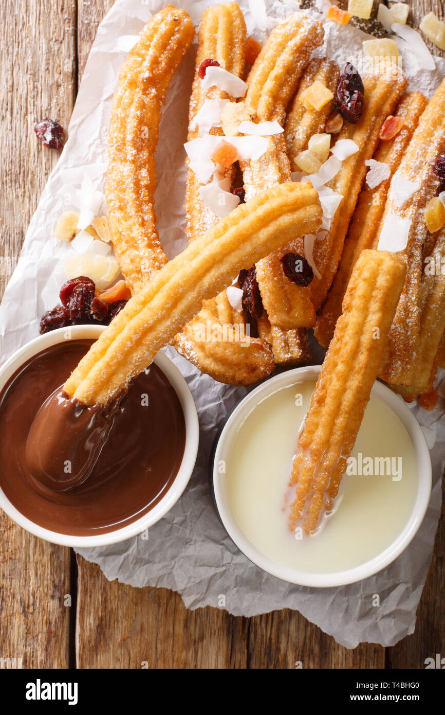 Deep-fried sweet churros served with hot chocolate and condensed milk ...