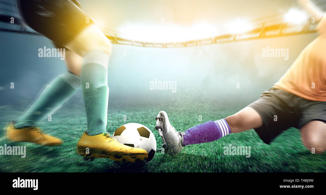 Football player woman in orange jersey sliding tackle the ball from his ...