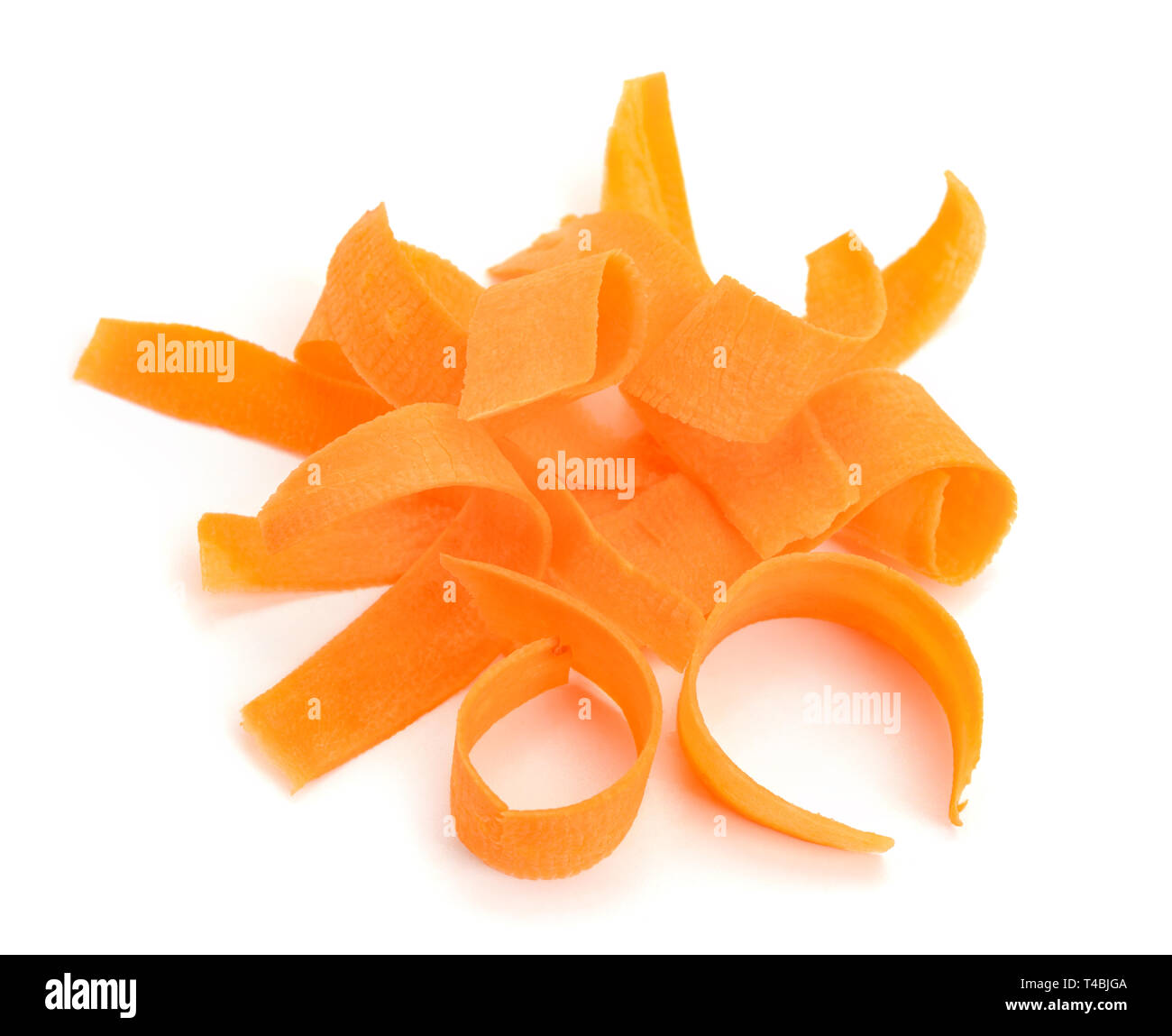 Carrot shavings on white background Stock Photo - Alamy