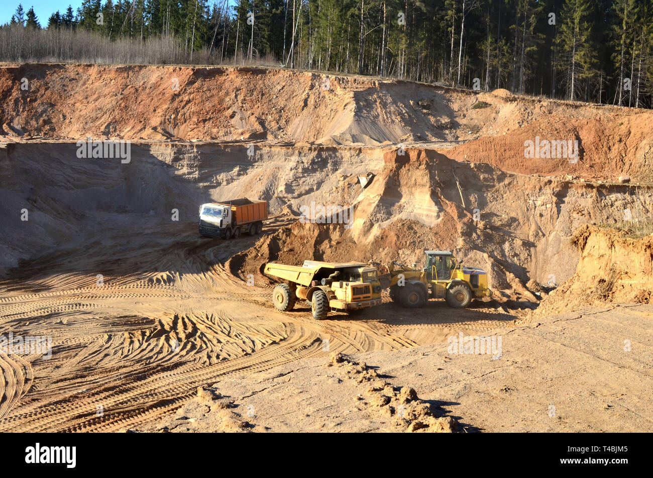 The work of heavy machinery and mining trucks for the transport of bulk ...