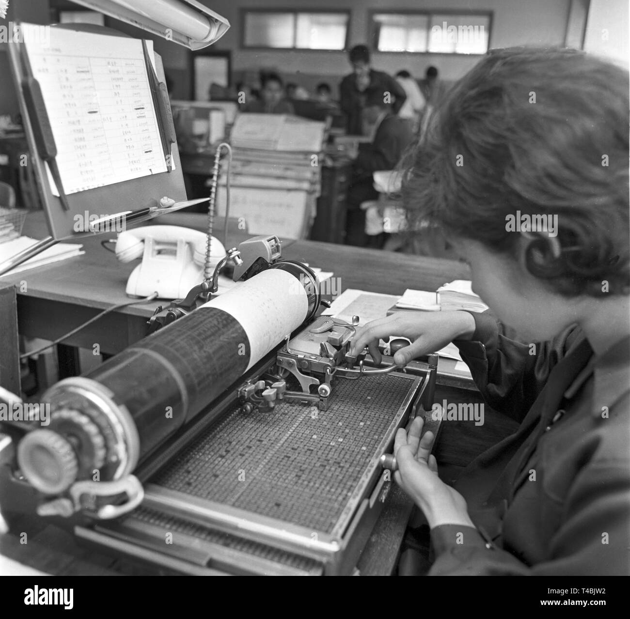 A Japanese stenotypist is working with a new typing machine (archive ...