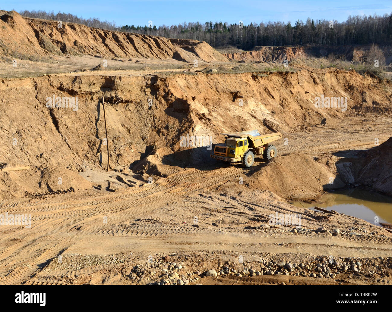 Heavy dump truck working in a sand pit - Image Stock Photo - Alamy