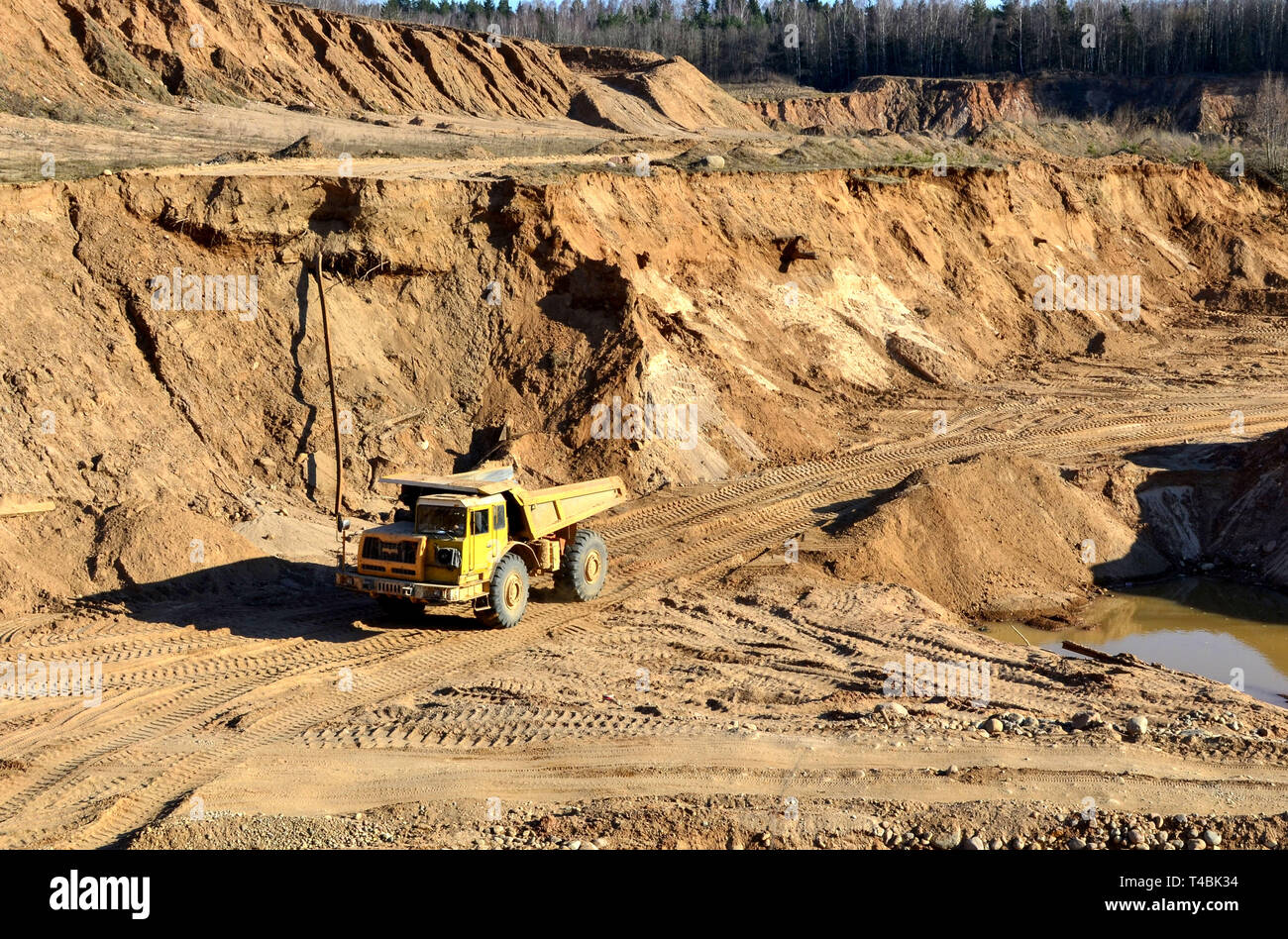 Heavy dump truck working in a sand pit - Image Stock Photo - Alamy