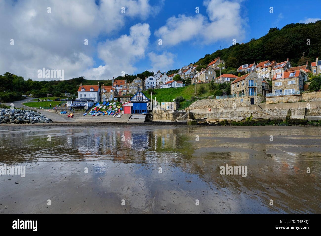 England, North Yorkshire, Runswick Bay. Small coastal village reflected ...