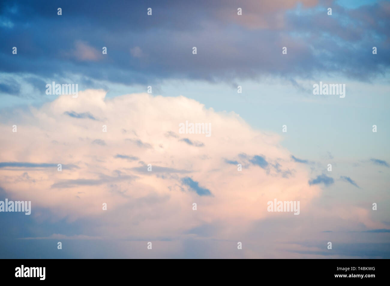 Blue sky background with white dramatic colorful clouds and sunlight ...