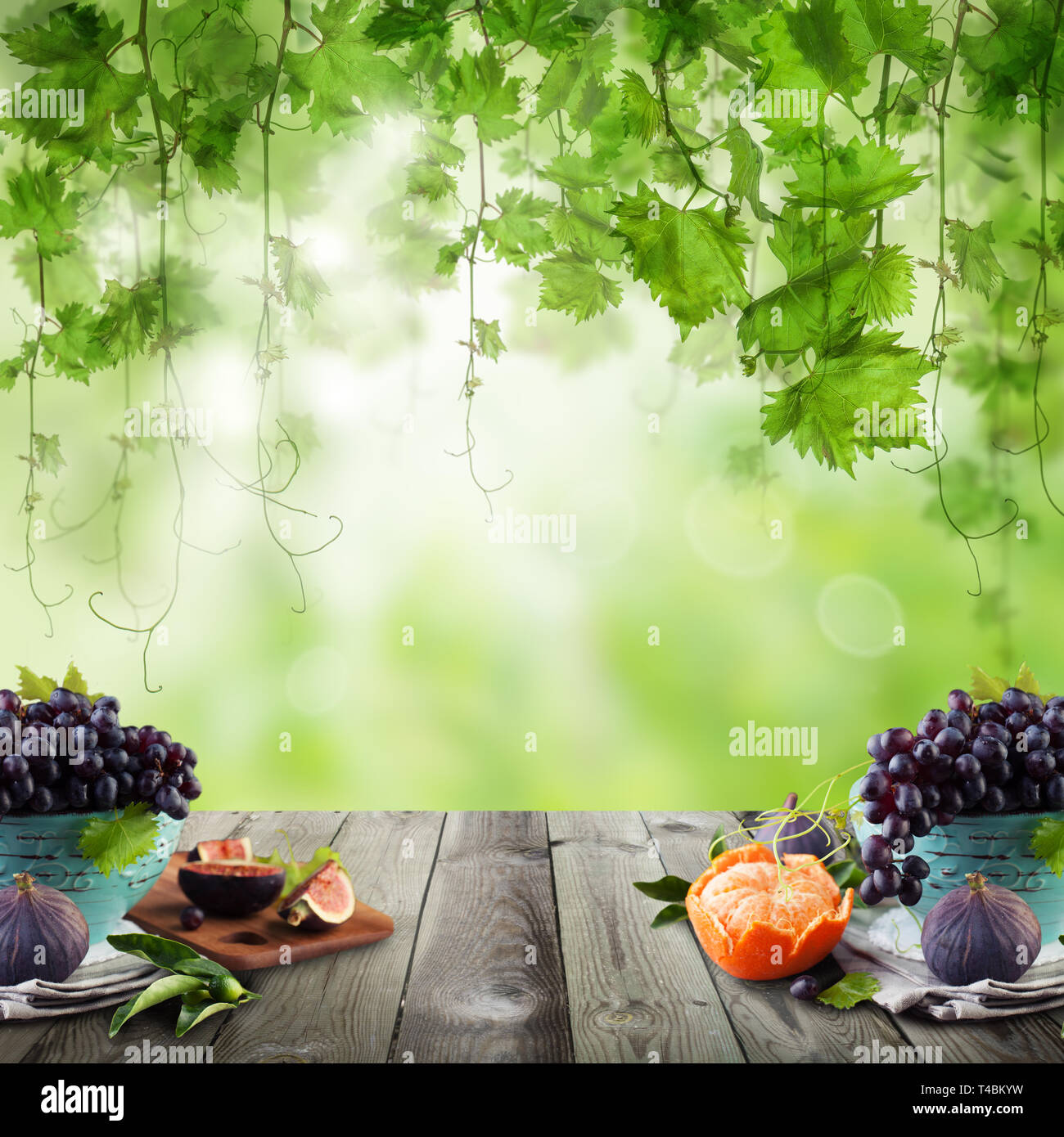 Fruit on dark wooden table in sunlight grapes garden. Natural morning ...