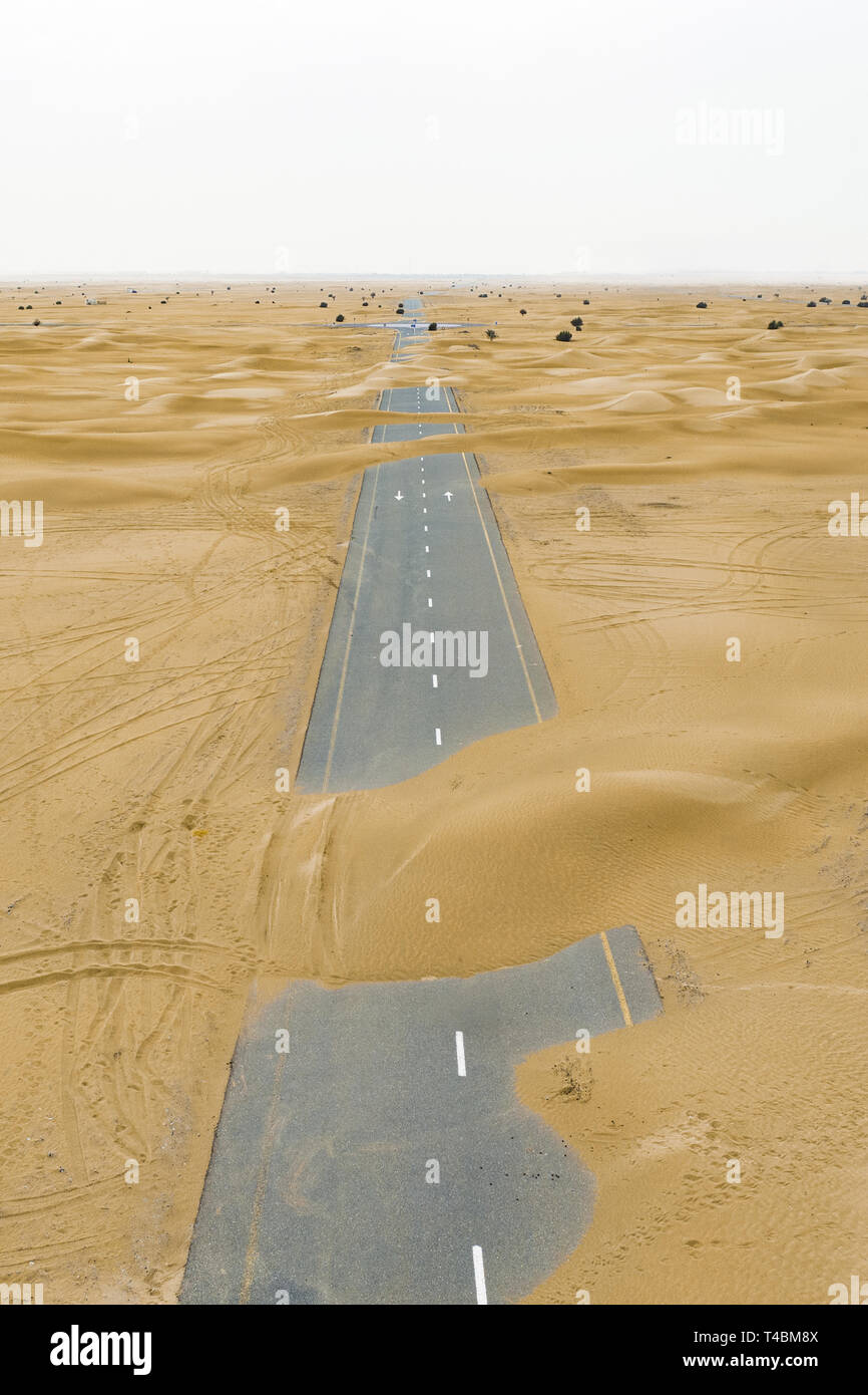 View from above, stunning aerial view of a deserted road covered by ...