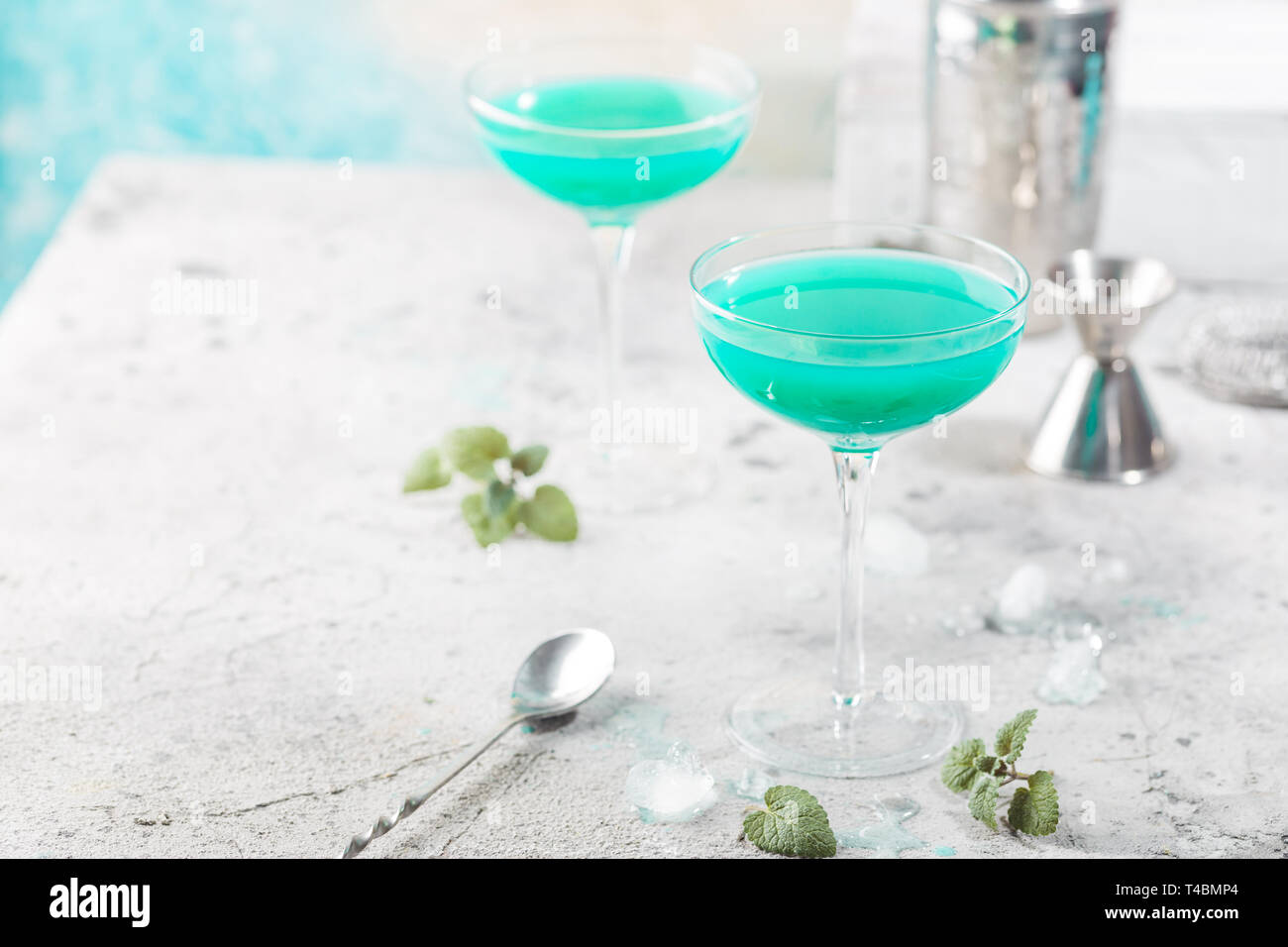 Colorful summer cocktail Blue Hawaii or iced blue lagoon alcohol drink ...